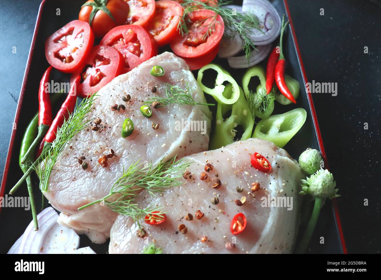 Meat with vegetables and spices, onions, red and green peppers, ginger ...