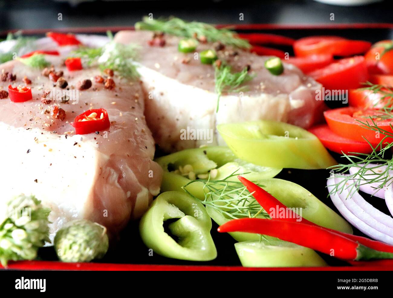 Meat with vegetables and spices, onions, red and green peppers, ginger ...