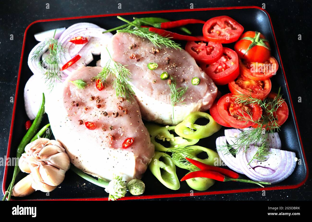 Meat with vegetables and spices, onions, red and green peppers, ginger ...