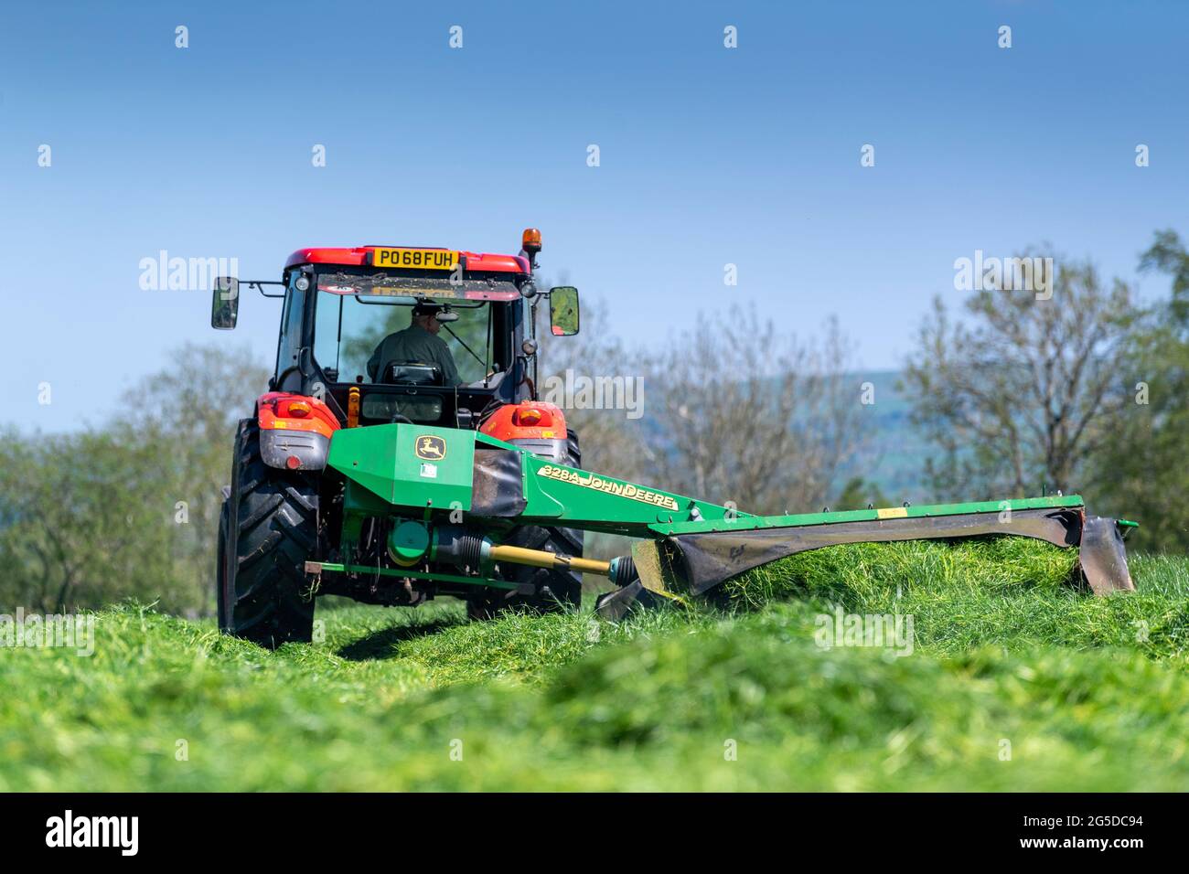 Mowing A Silage Meadow For First Cut Of Silage In Early June For A