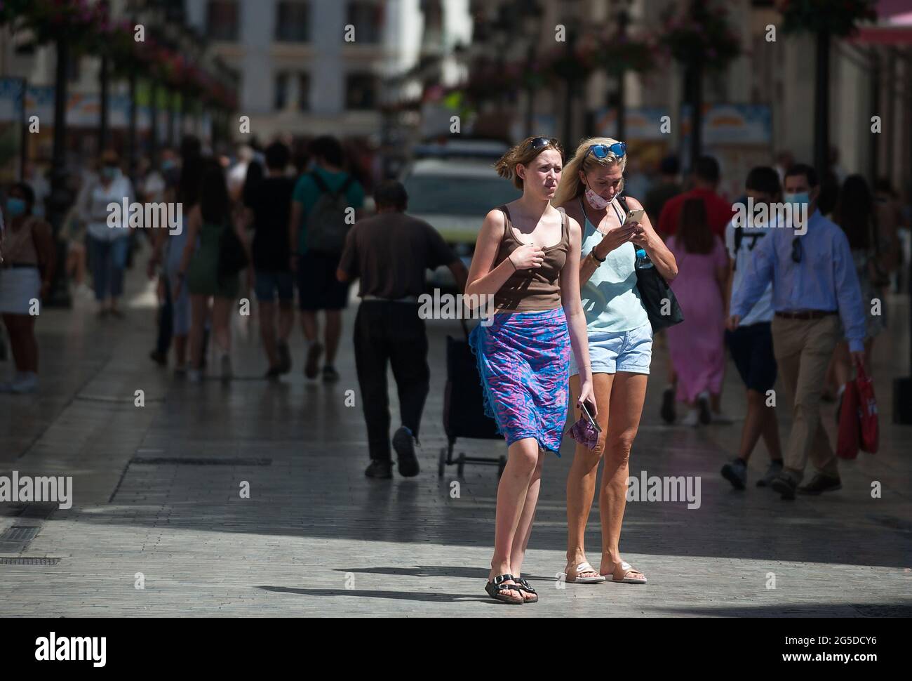 Women without face masks hi-res stock photography and images - Alamy
