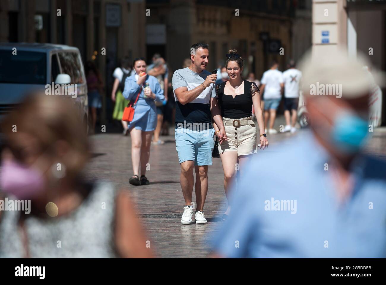 People without face masks are seen walking at Plaza de la Constitucion ...