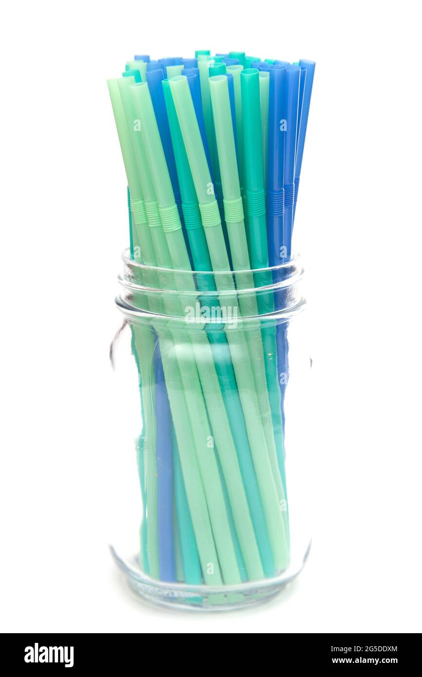 Bunch of Straws in a Glass Container on a White Background Stock Photo ...