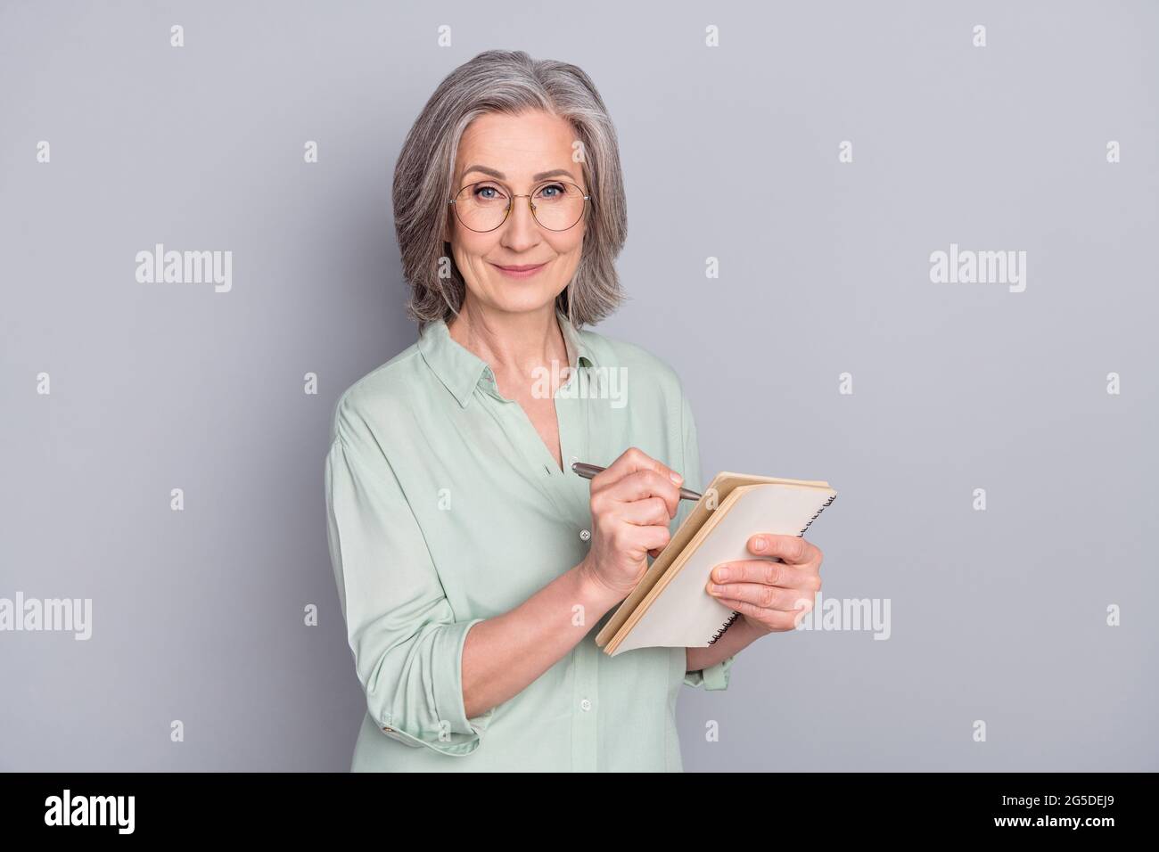 Photo of happy lovely pretty smiling mature woman author in glasses ...