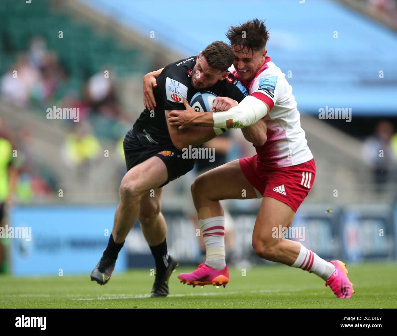 Harlequins' Cadan Murley (right) tackles Exeter Chiefs' Alex Cuthbert ...