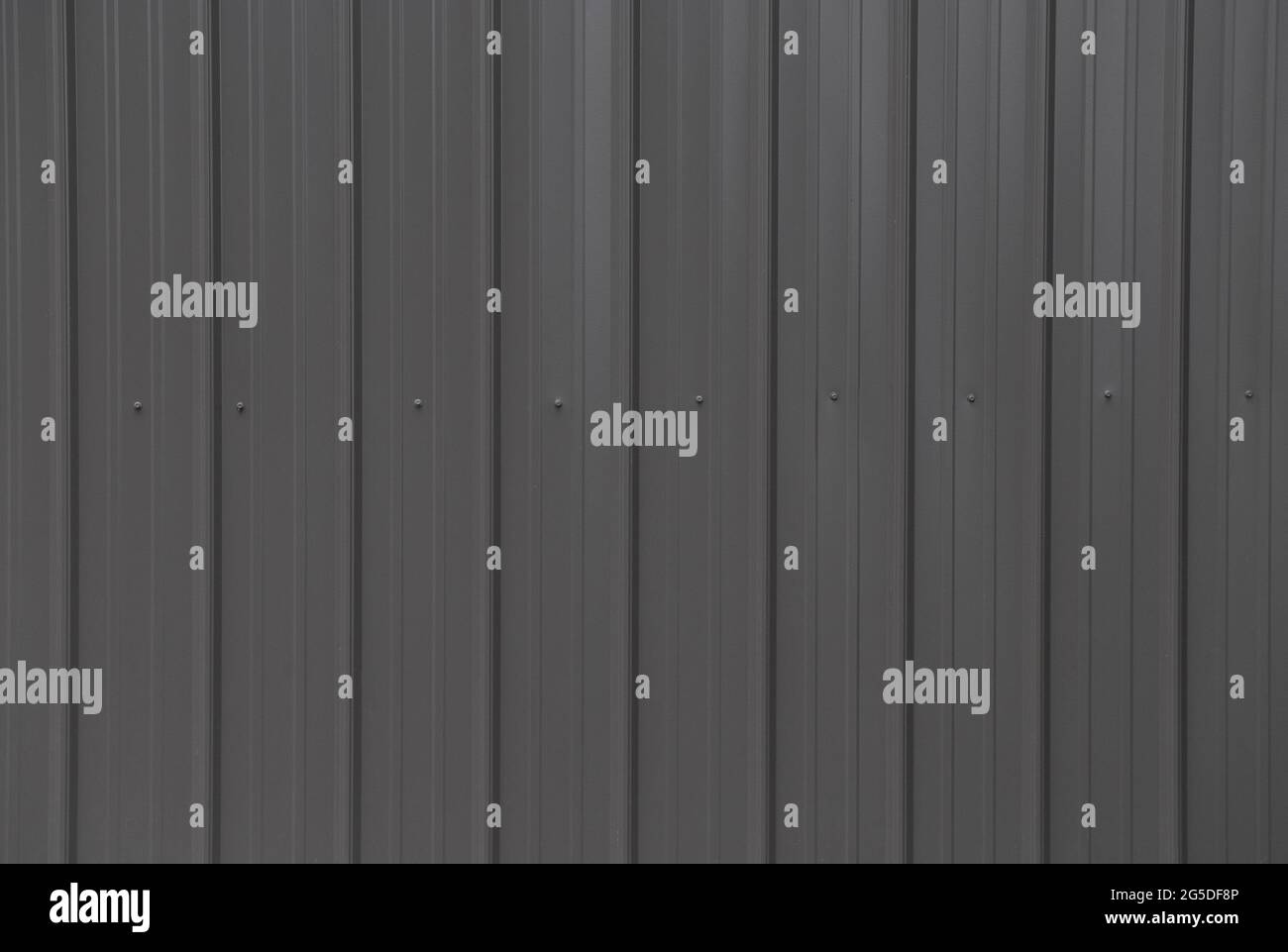 A Background of Dark Brown Metal Siding on a Building Stock Photo - Alamy