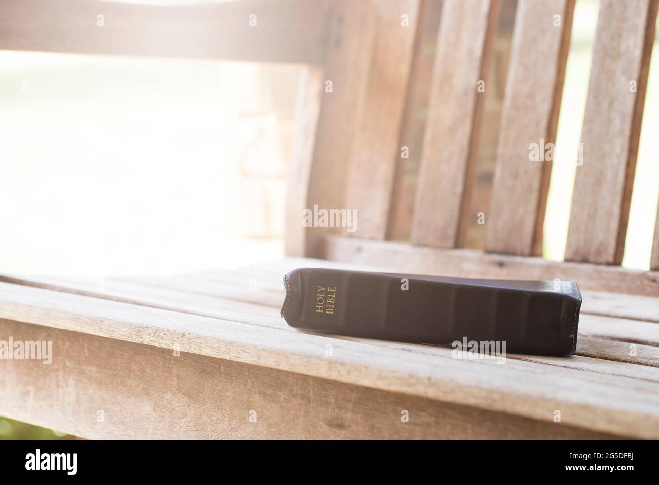 Personal Bible Study Outside on a Patio Swing Stock Photo - Alamy