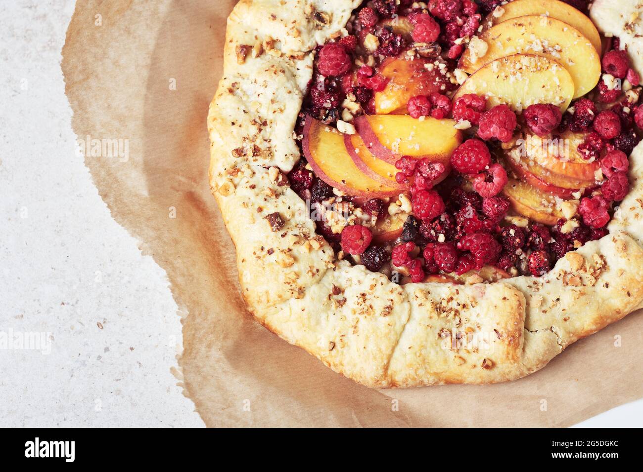 Raspberry tart, open pie on a light background Stock Photo - Alamy