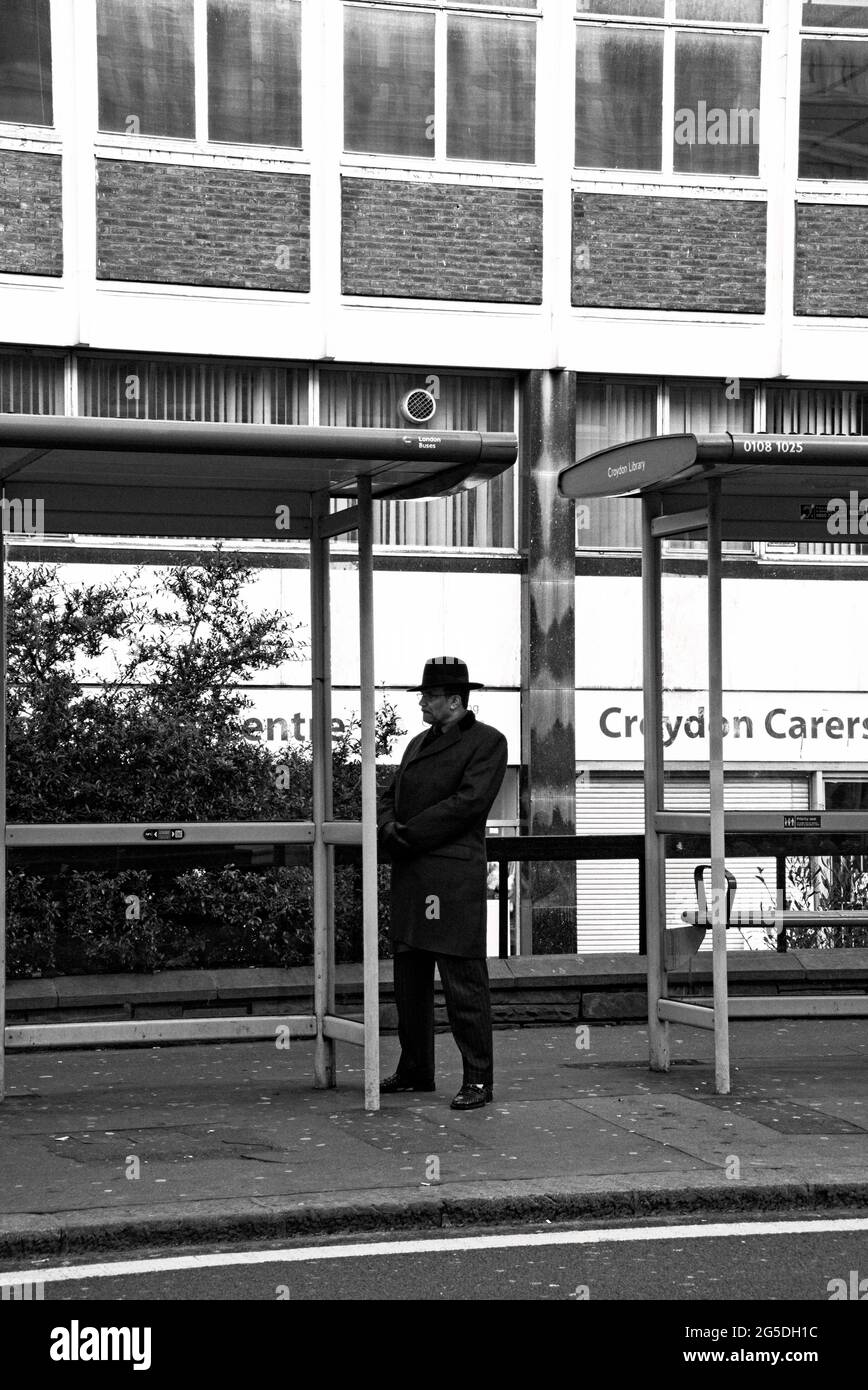 Black man at bus stop hi-res stock photography and images - Alamy