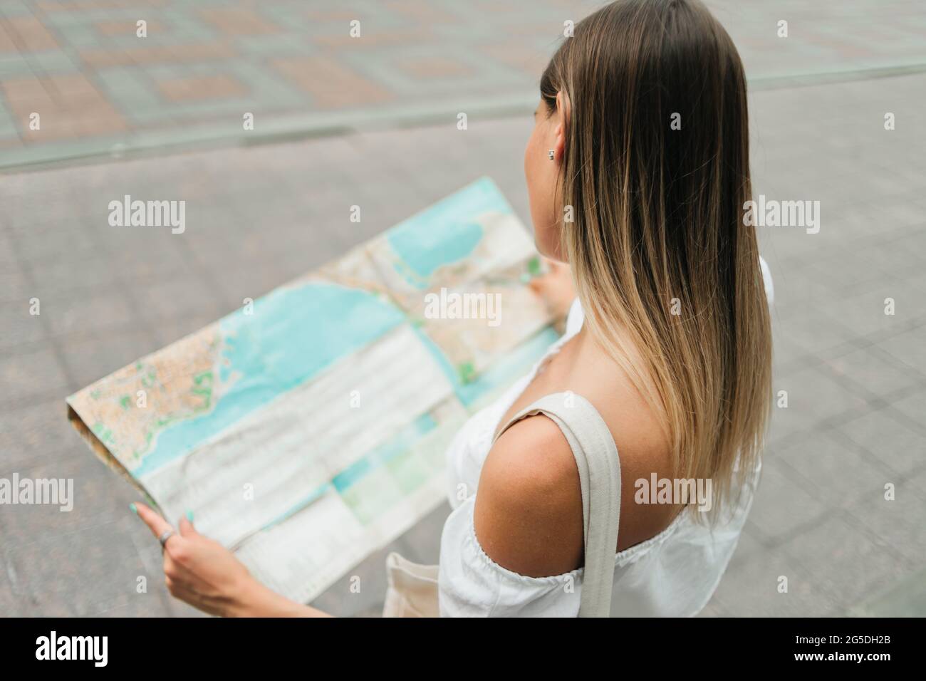 Woman tourist explore city map outdoor. Top view Stock Photo - Alamy