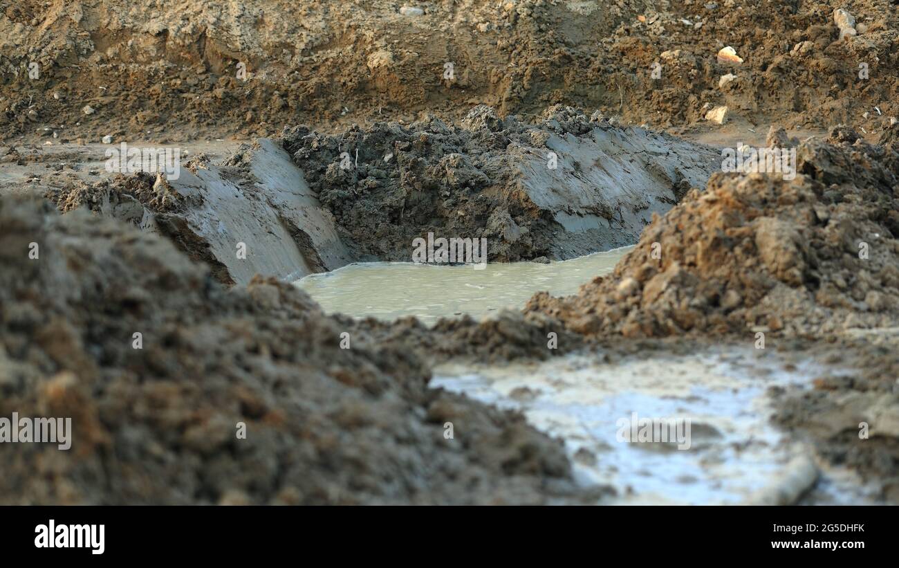 Construction trenches flooded with rainwater Stock Photo - Alamy