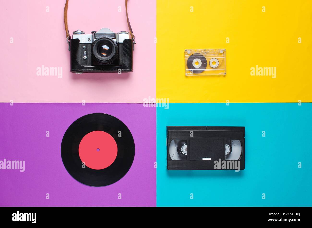 Retro top view still life. Vinyl record, vintage film camera, video and ...