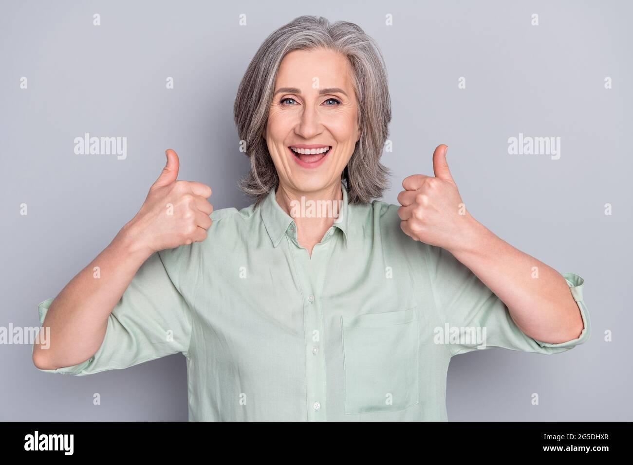 Photo of happy excited cheerful good mood mature woman showing thumb-up ...