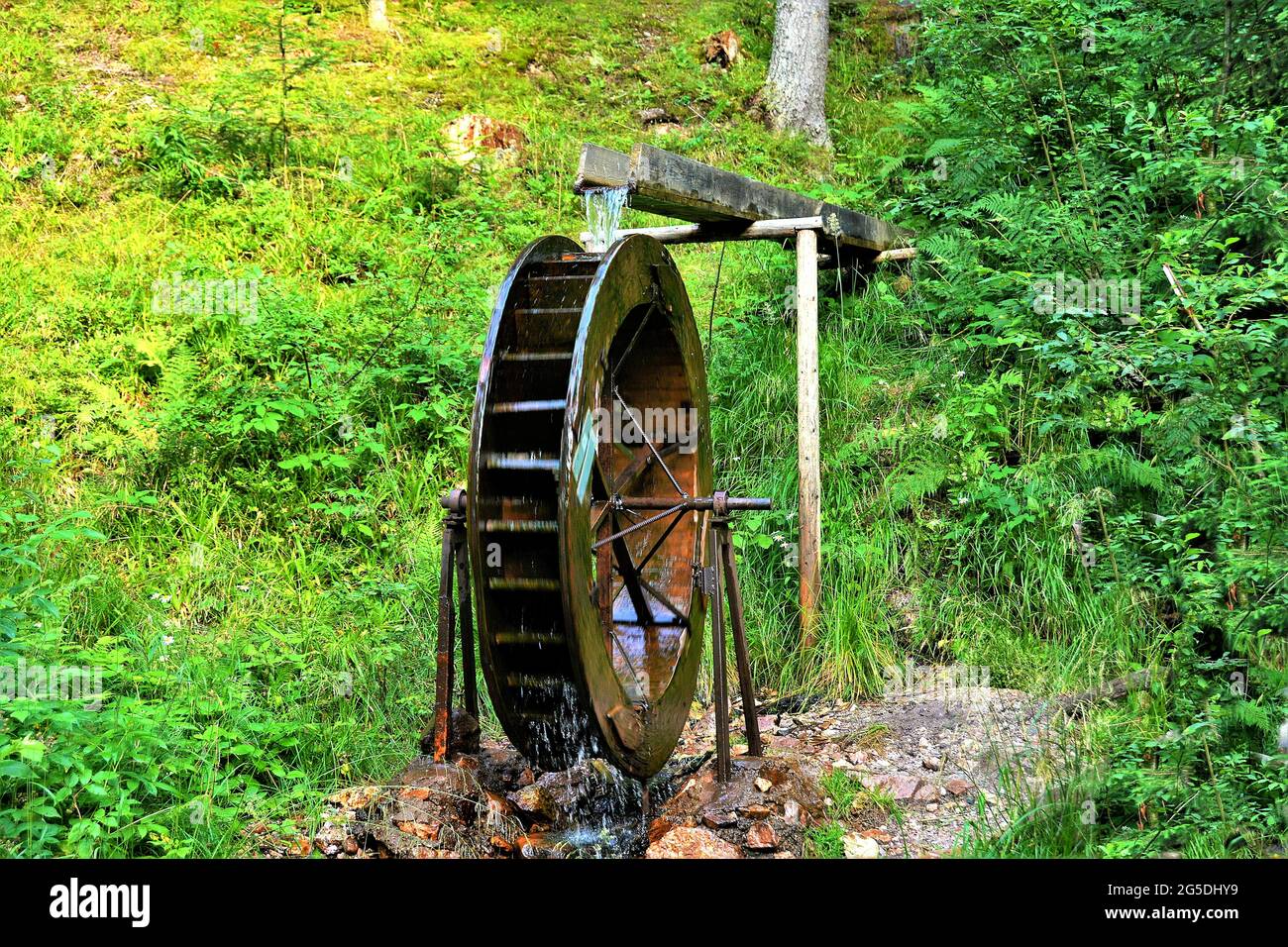 Water-mill with fresh water flowing from the mountain Stock Photo - Alamy