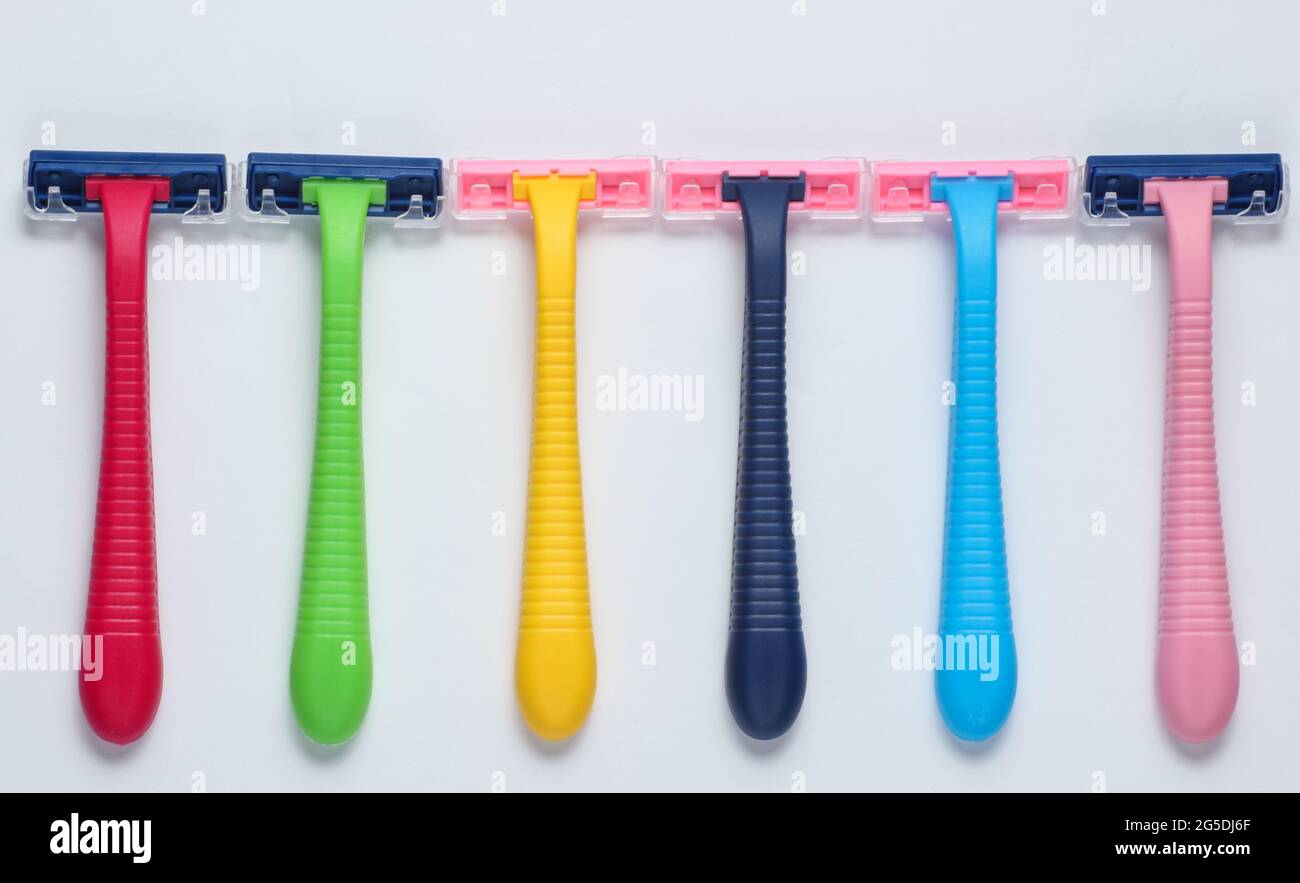 Many colored plastic razors on white background. Top view Stock Photo ...