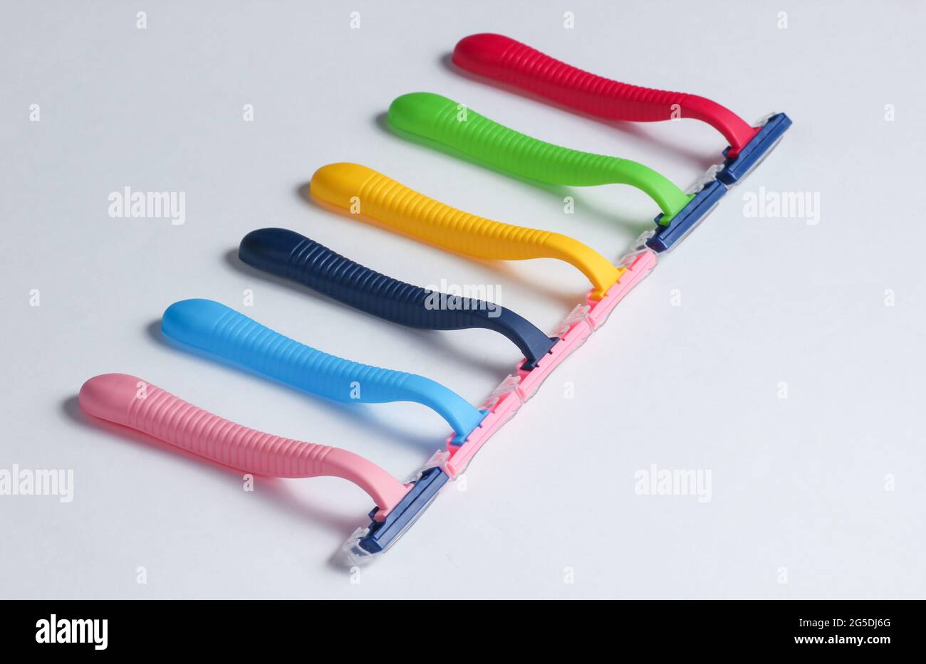 Many colored plastic razors on white background Stock Photo - Alamy