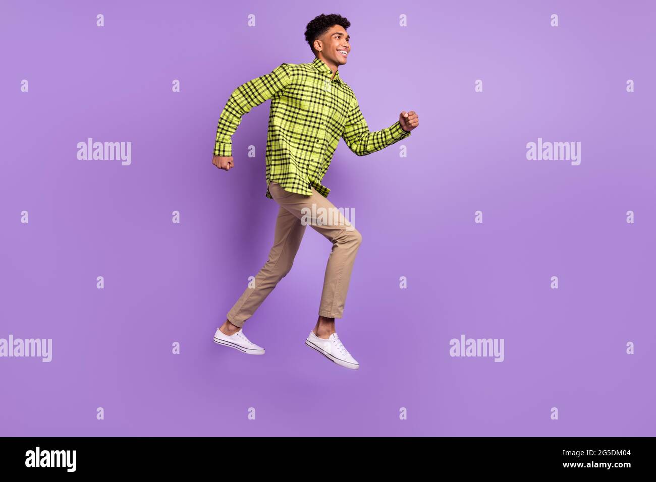 Full length body size of young jumping high running on sale smiling ...
