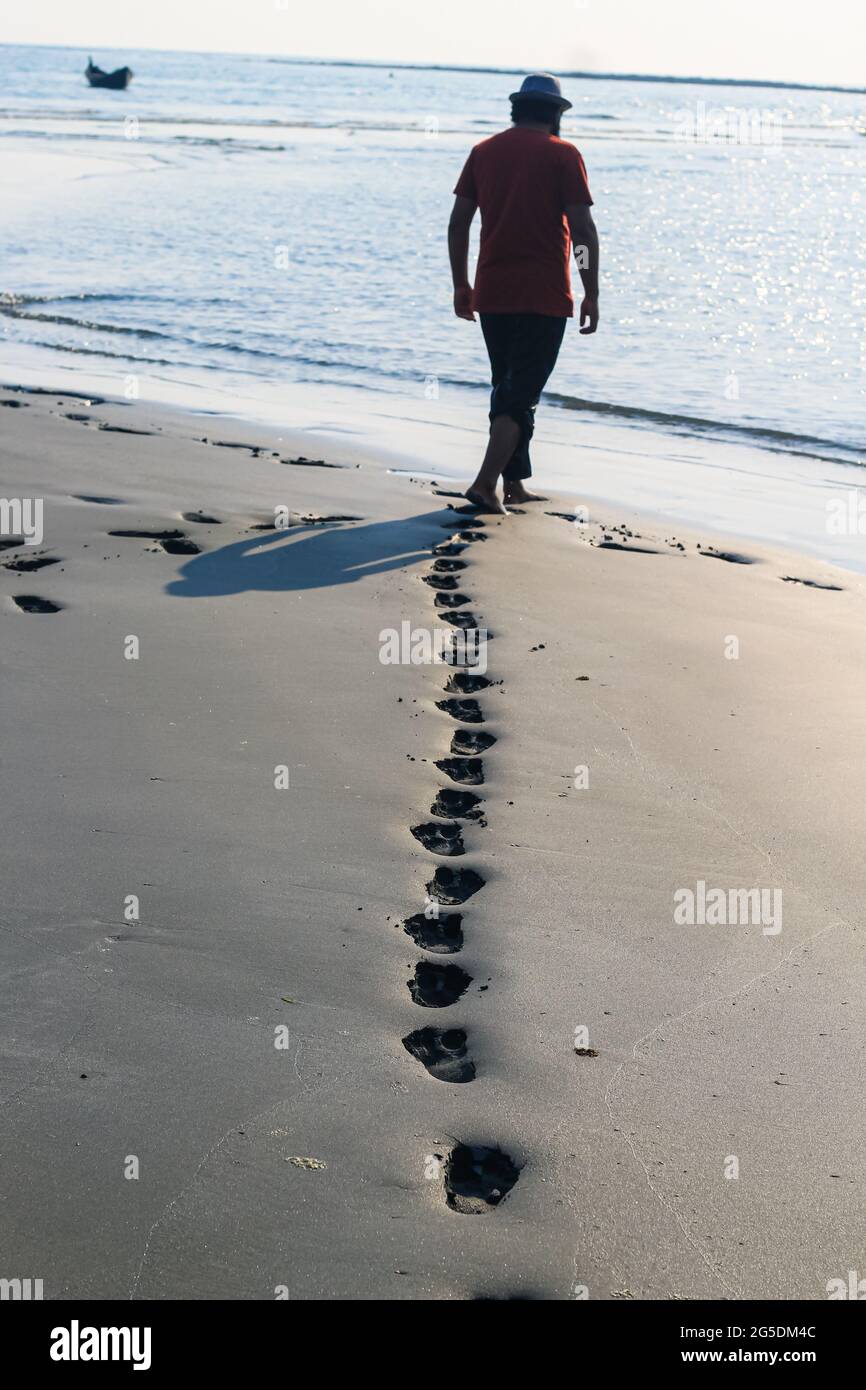 Footprints on the beach sand. Traces on the beach. Footsteps on the ...