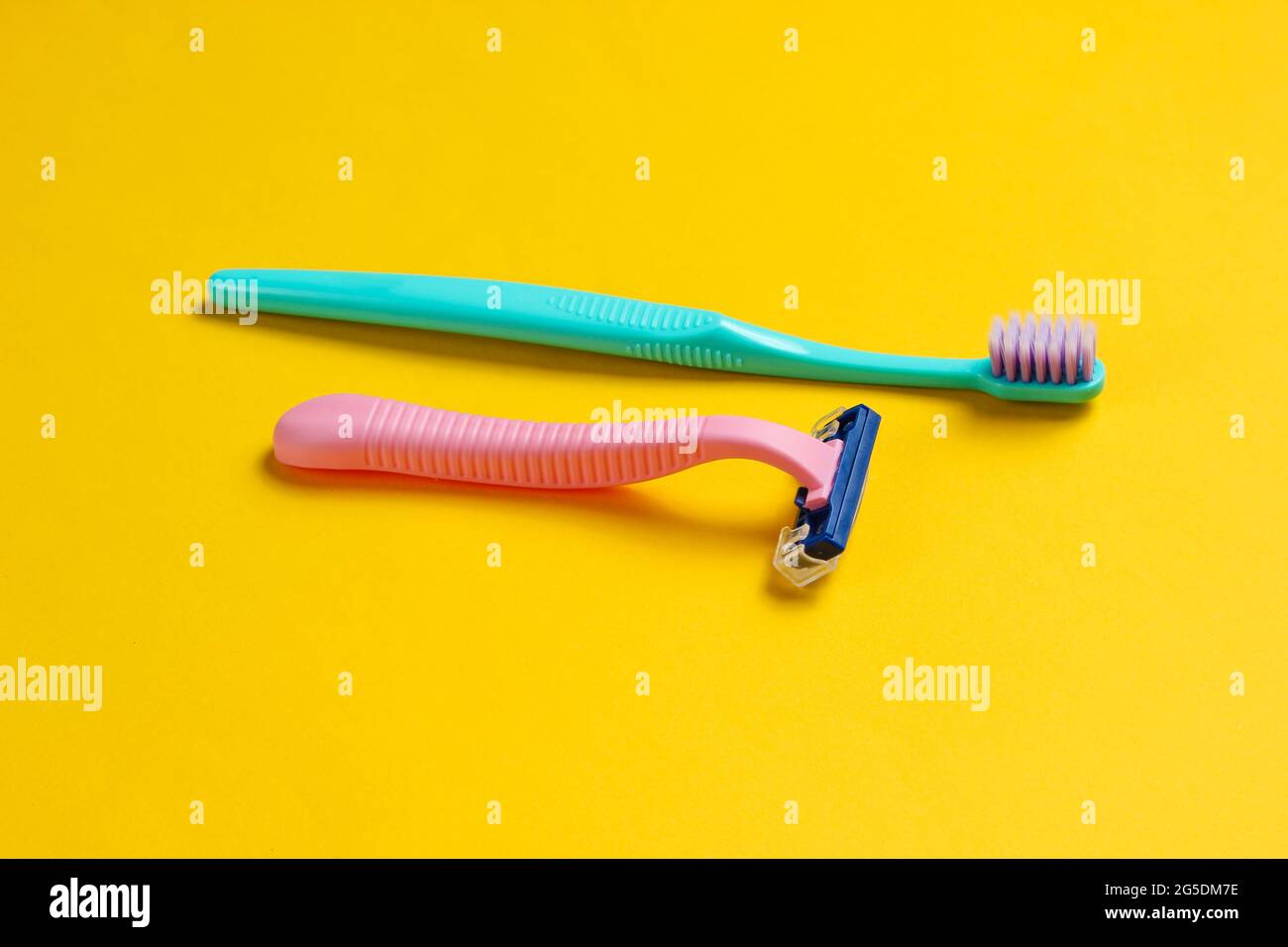 Minimalistic personal care, beauty concept. Plastic razor, toothbrush ...