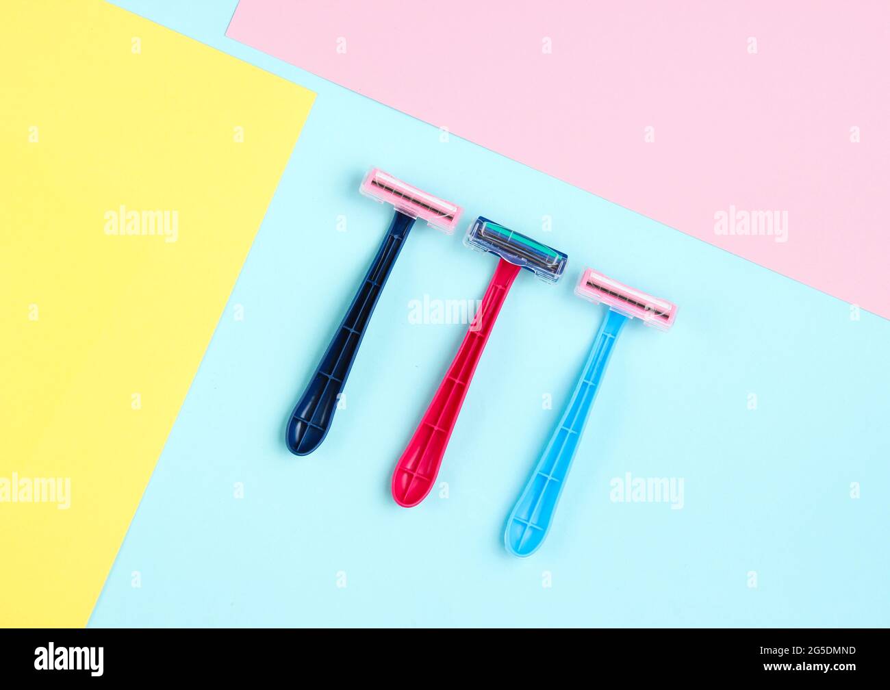 Minimalistic beauty concept. Epilation. Plastic colored razors on ...