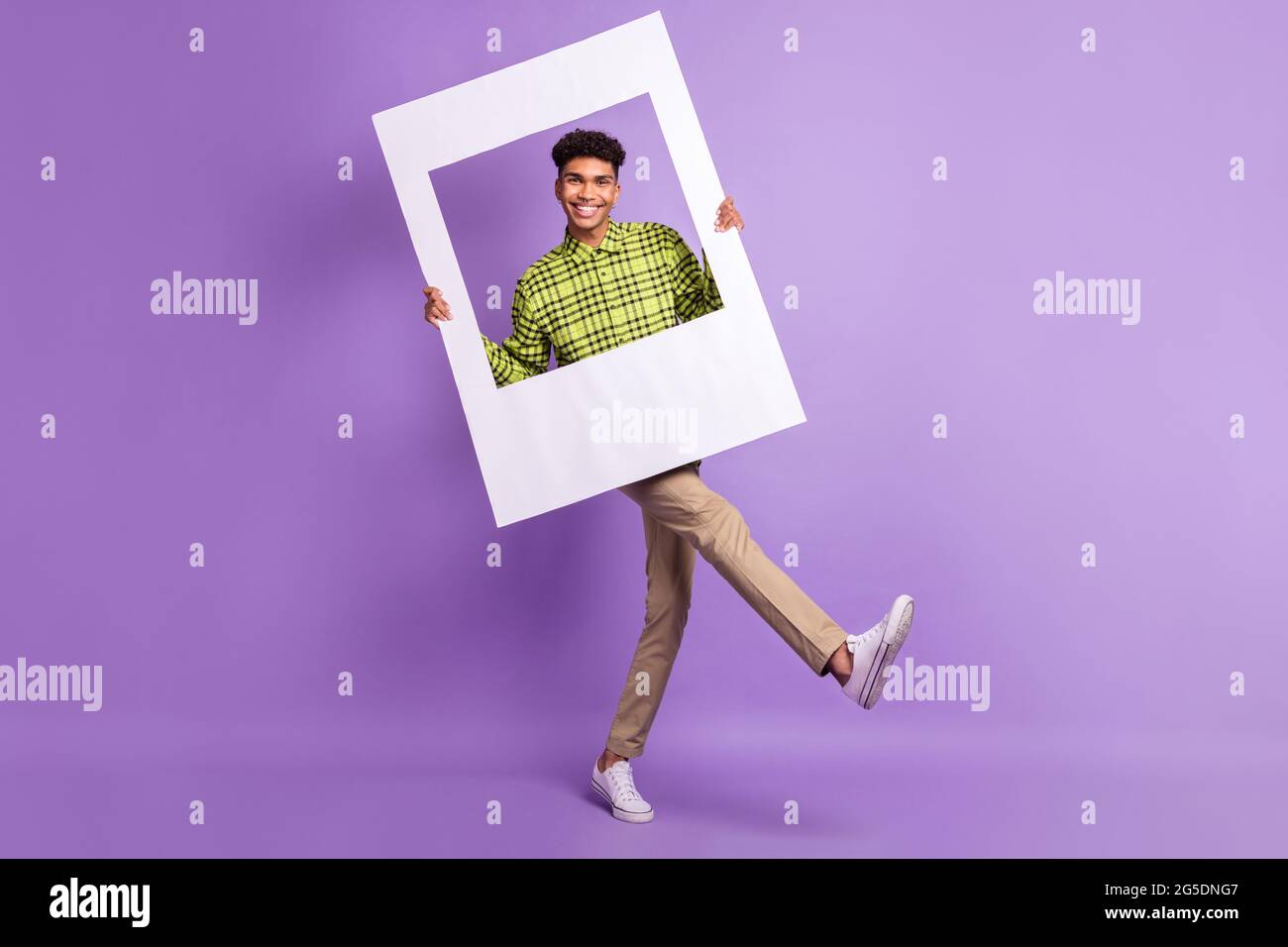 Full length body size of young man keeping photo frame cadre smiling on ...