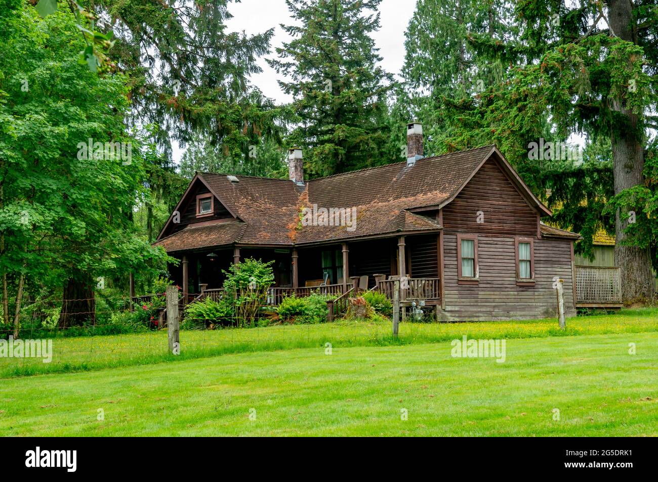 Beautiful wooden hut by the forest Stock Photo - Alamy