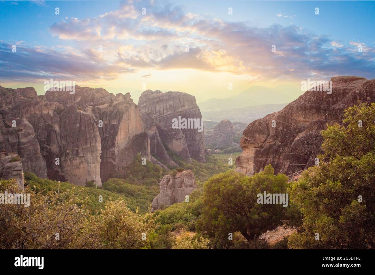 Mountain, forest and sky clouds in Meteora, Greece Stock Photo - Alamy