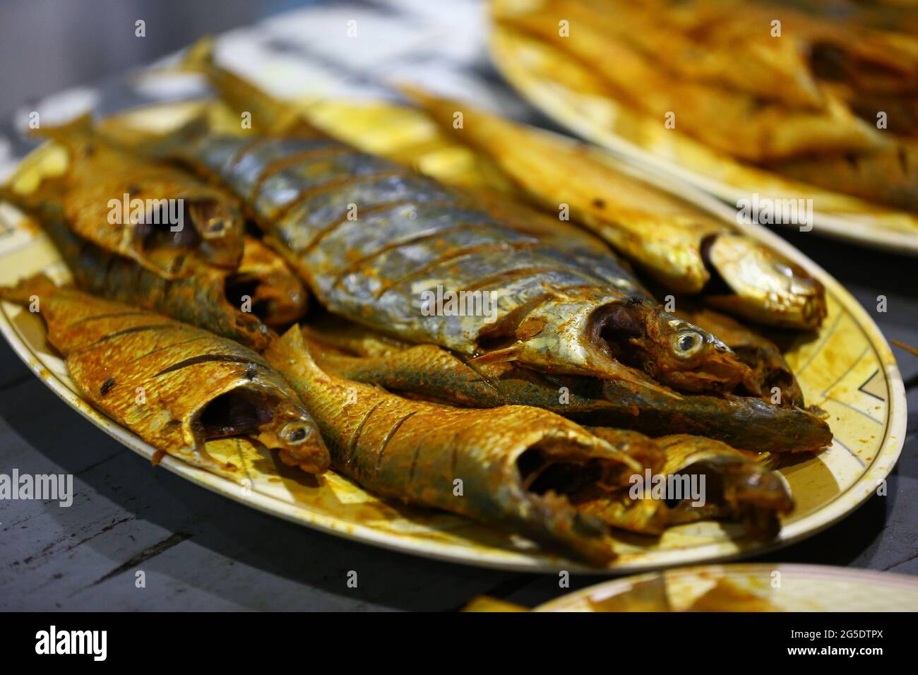Preparing fish at kitchen. Raw fish ready to cook Stock Photo - Alamy