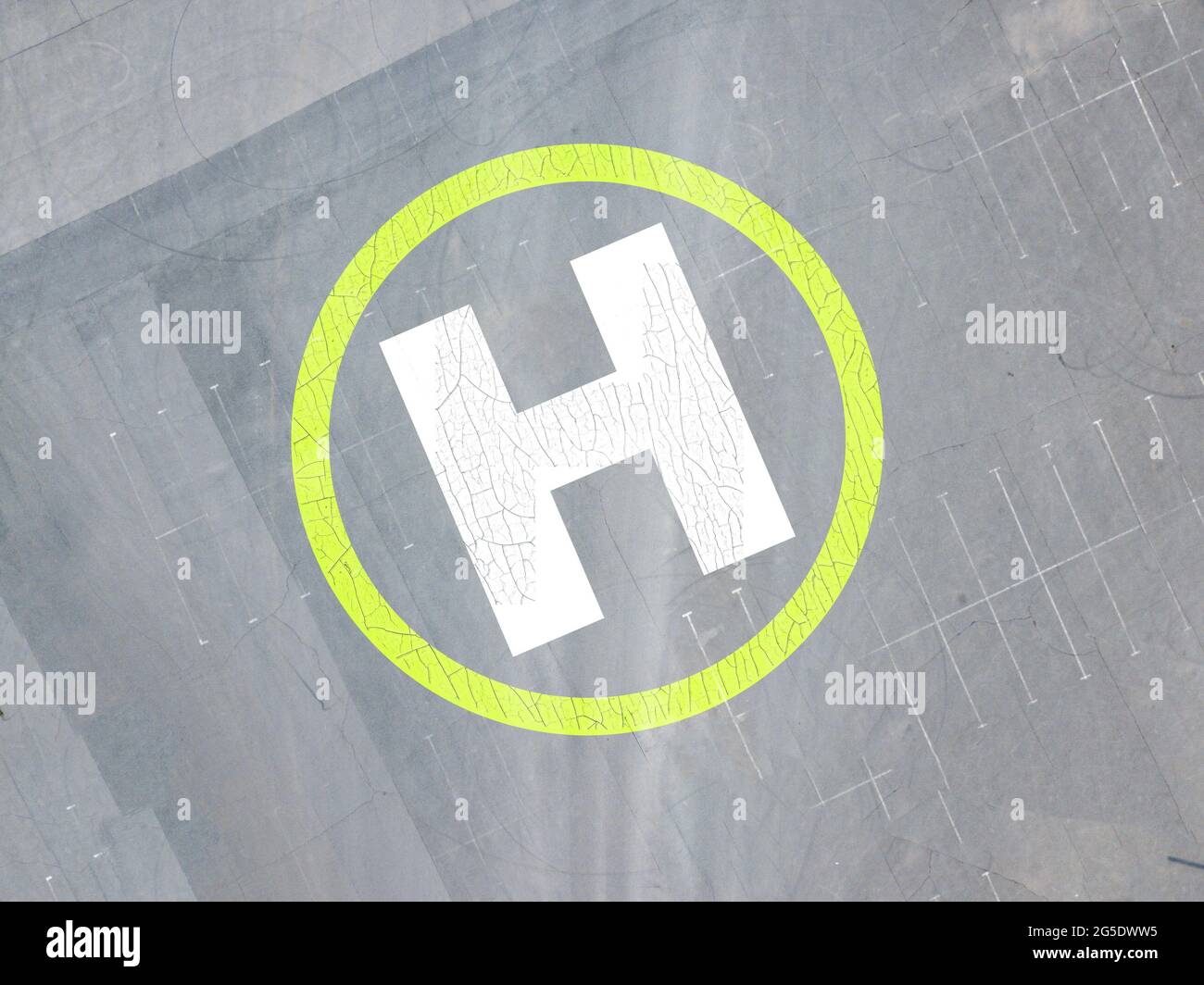 helicopter helipad on the asphalt surface with letter "H" view from ...