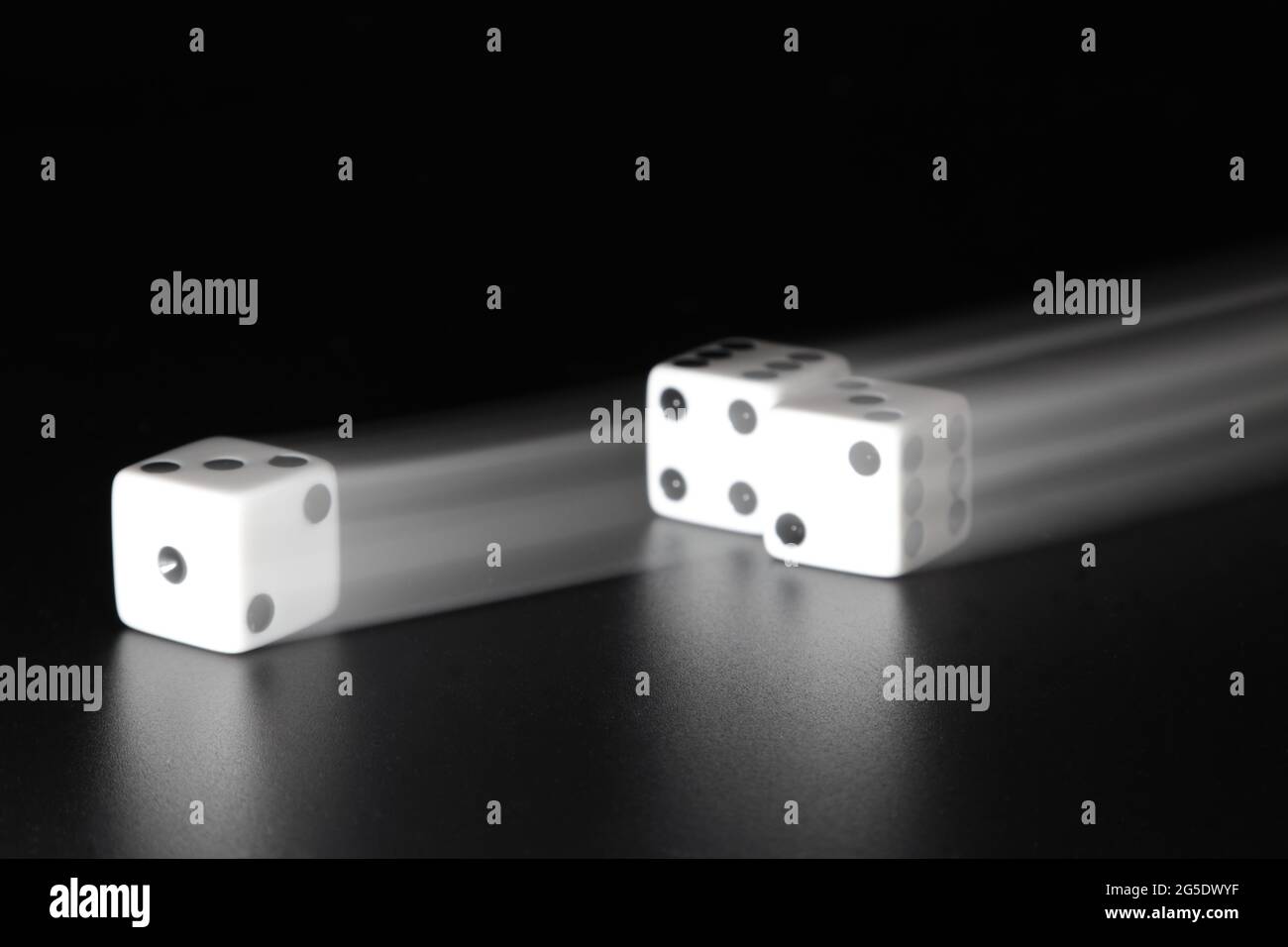 Dice with motion blur Stock Photo - Alamy