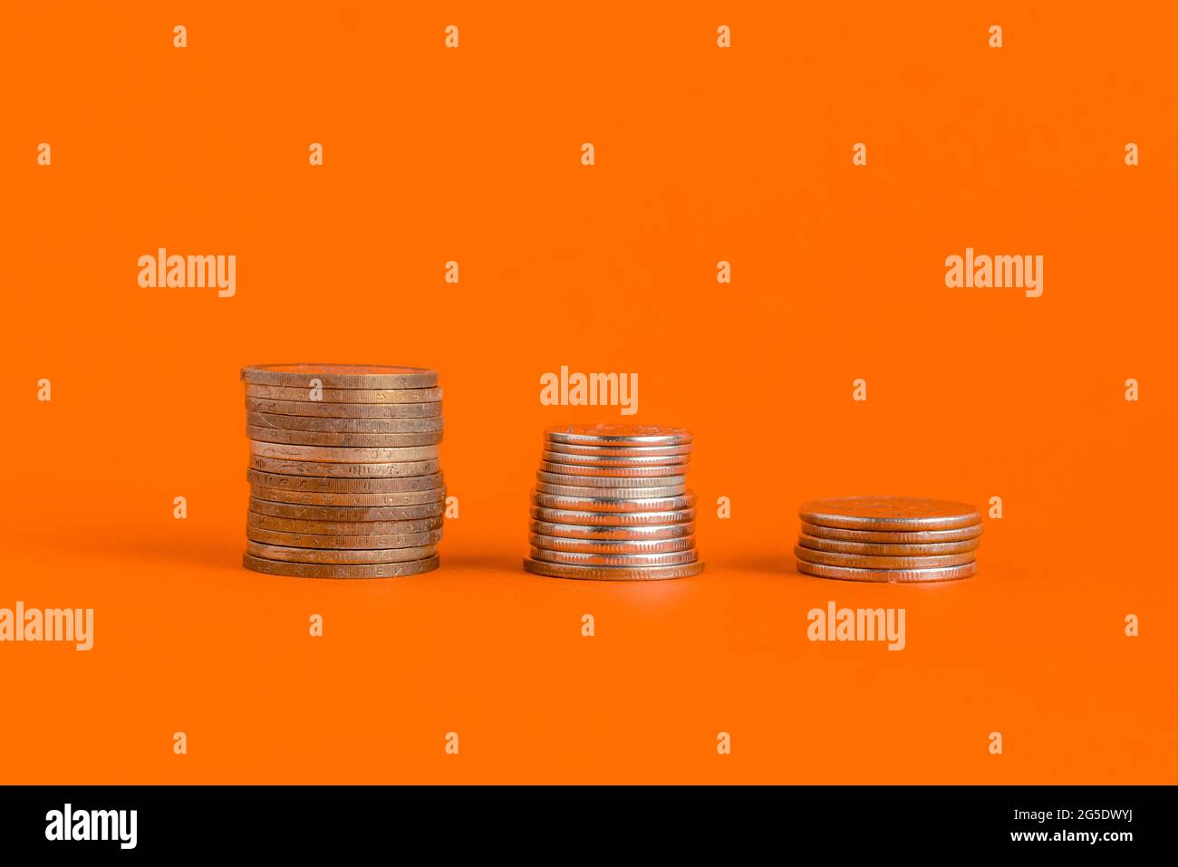 stack of cash coins showing increase graph on color surface Stock Photo ...