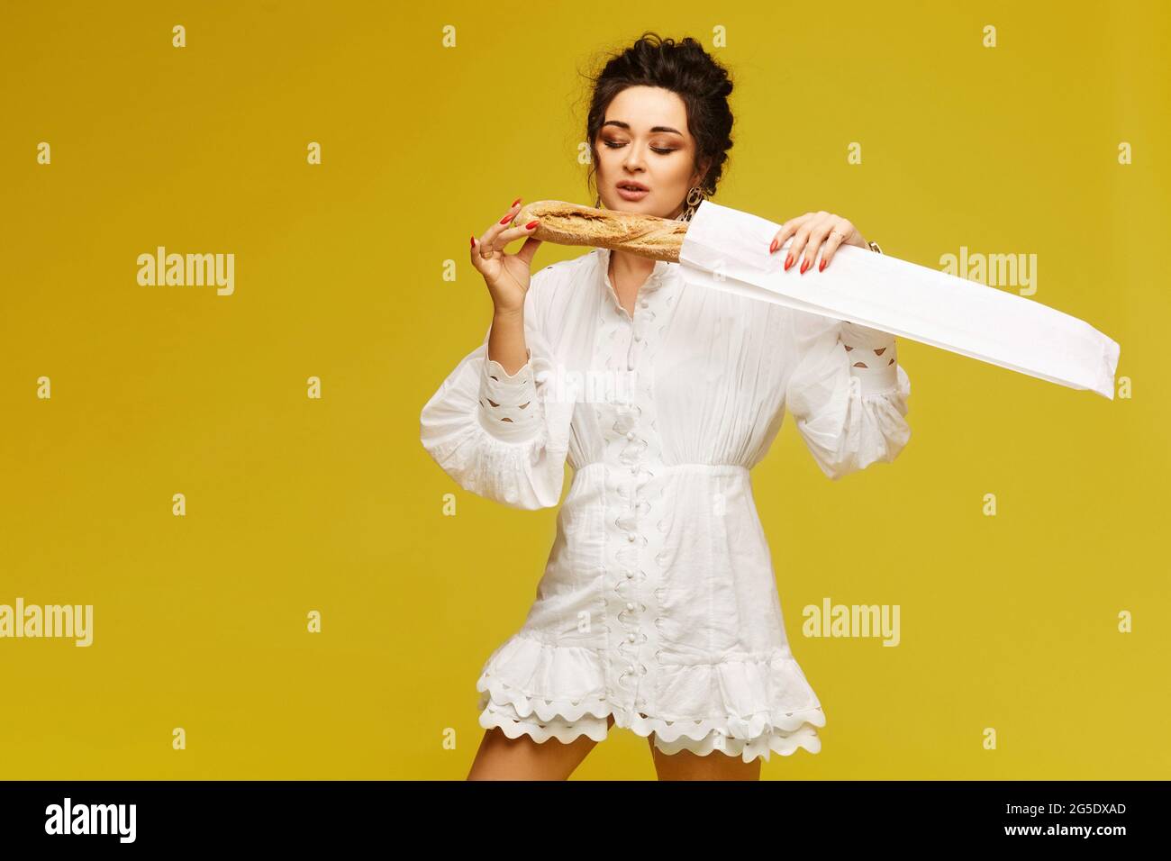 Young model woman with red manicure and bright makeup wearing white ...