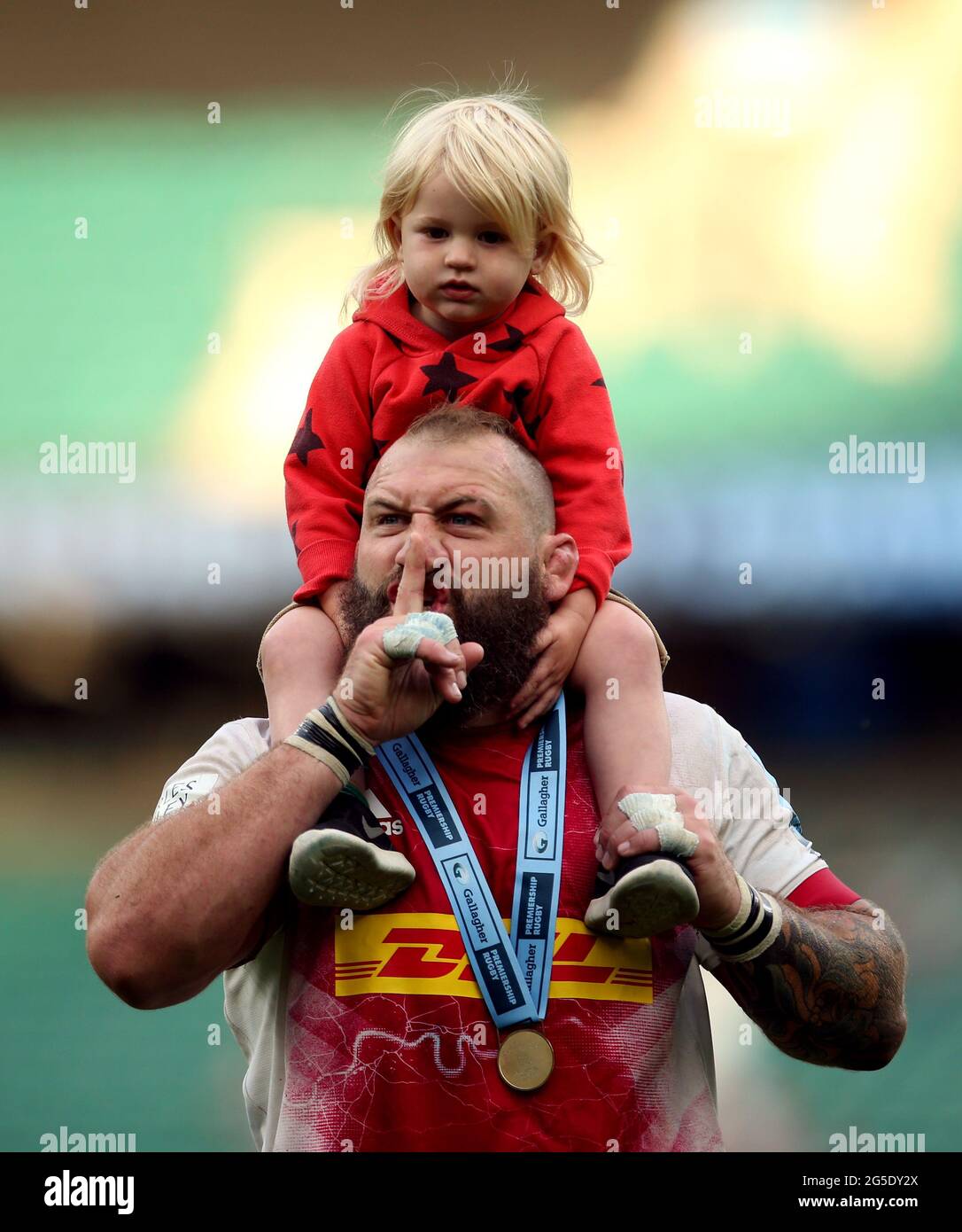 Celebrates with his child after the final whistle hi-res stock ...