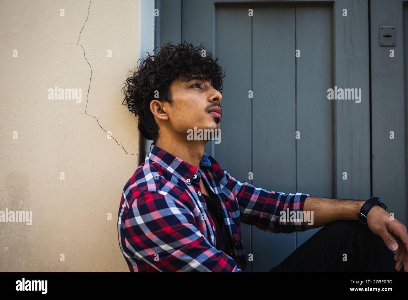 Young exotic boy model posing on the street Stock Photo - Alamy