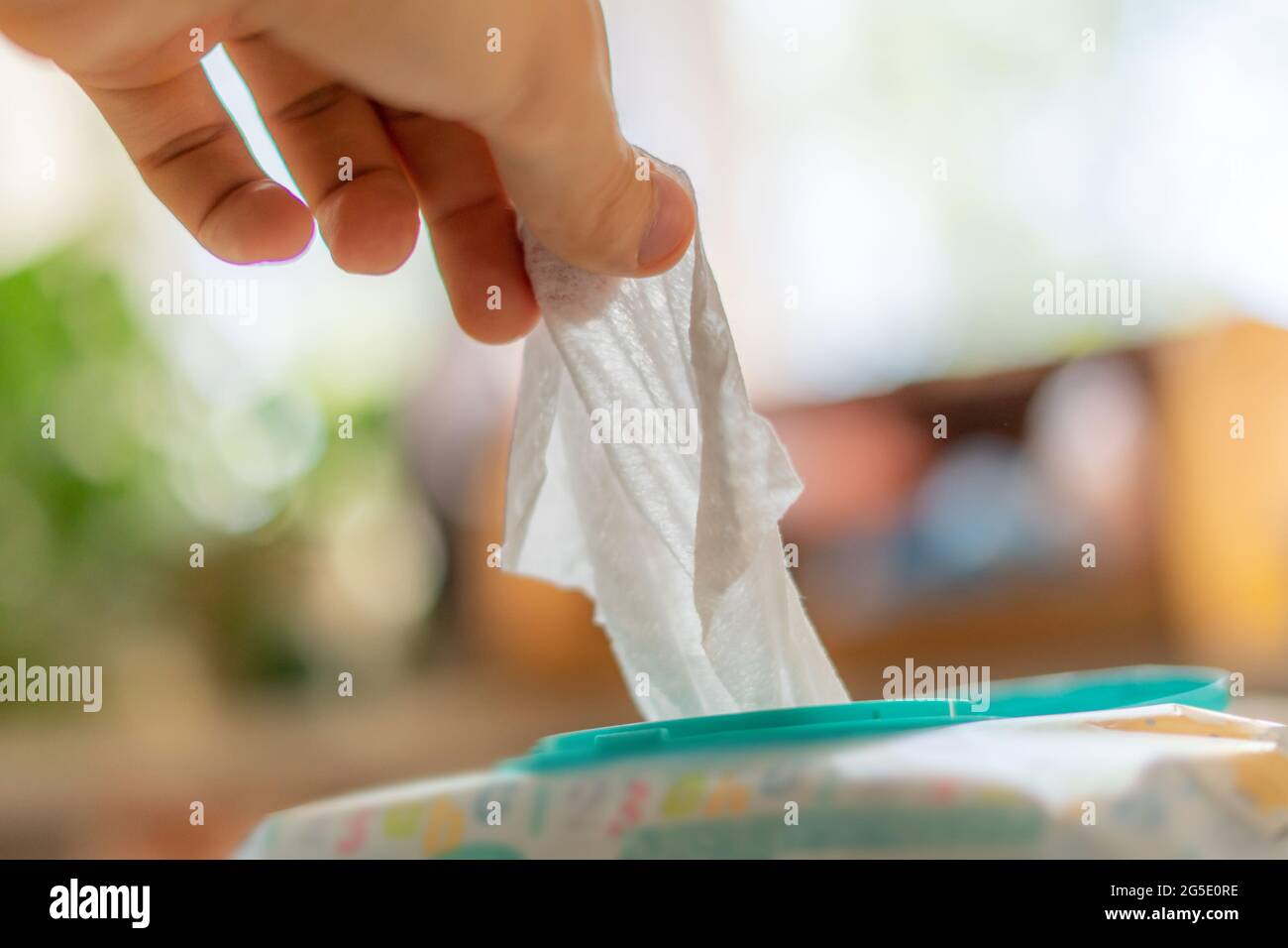 hand taking the wet wipe to clean skin Stock Photo - Alamy