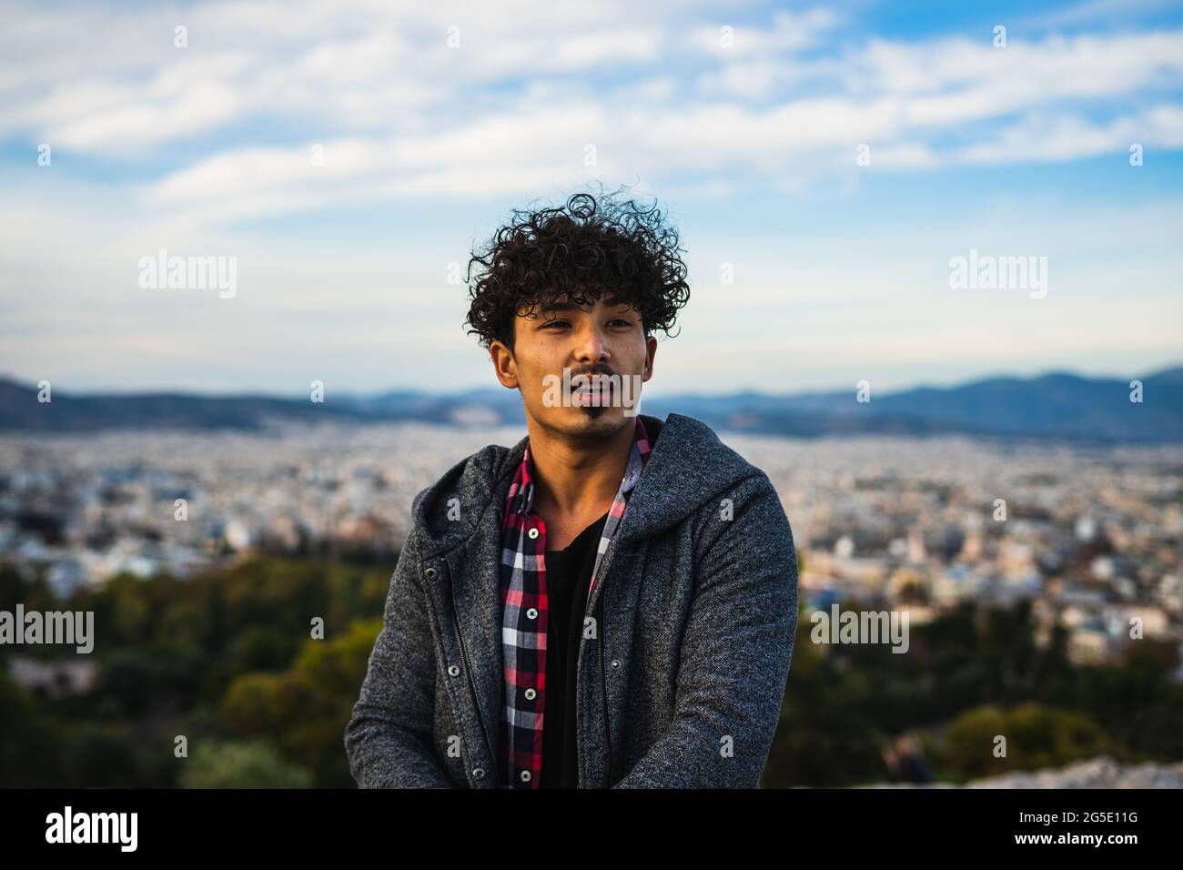 Young exotic boy model posing on the street Stock Photo - Alamy