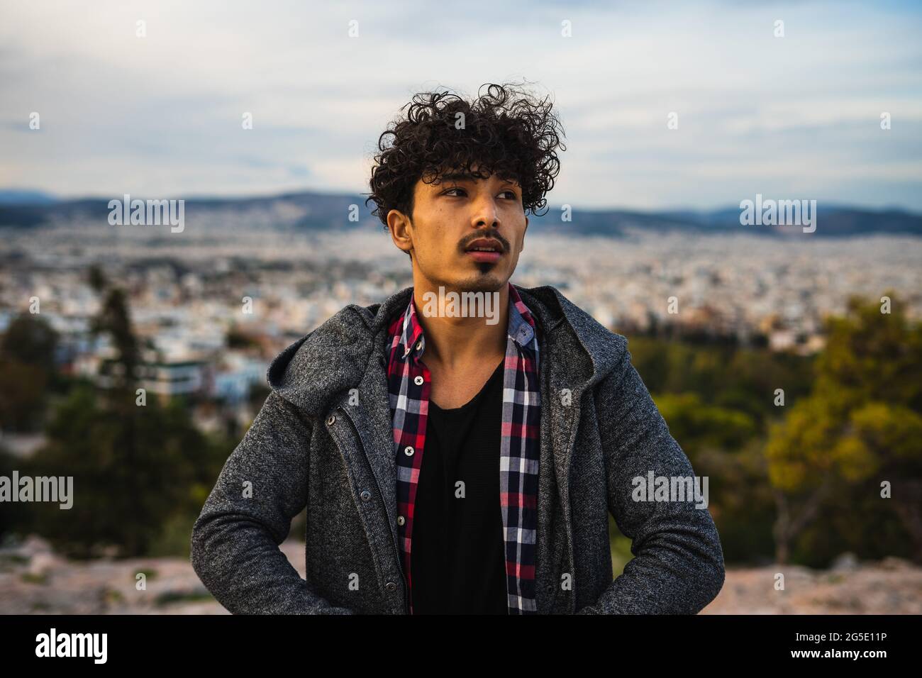 Young exotic boy model posing on the street Stock Photo - Alamy