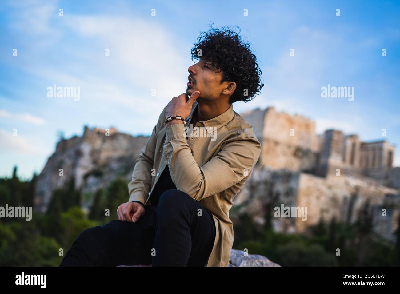 Young exotic boy model posing on the street Stock Photo - Alamy