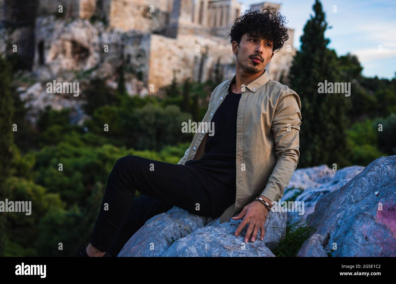 Young exotic boy model posing on the street Stock Photo - Alamy