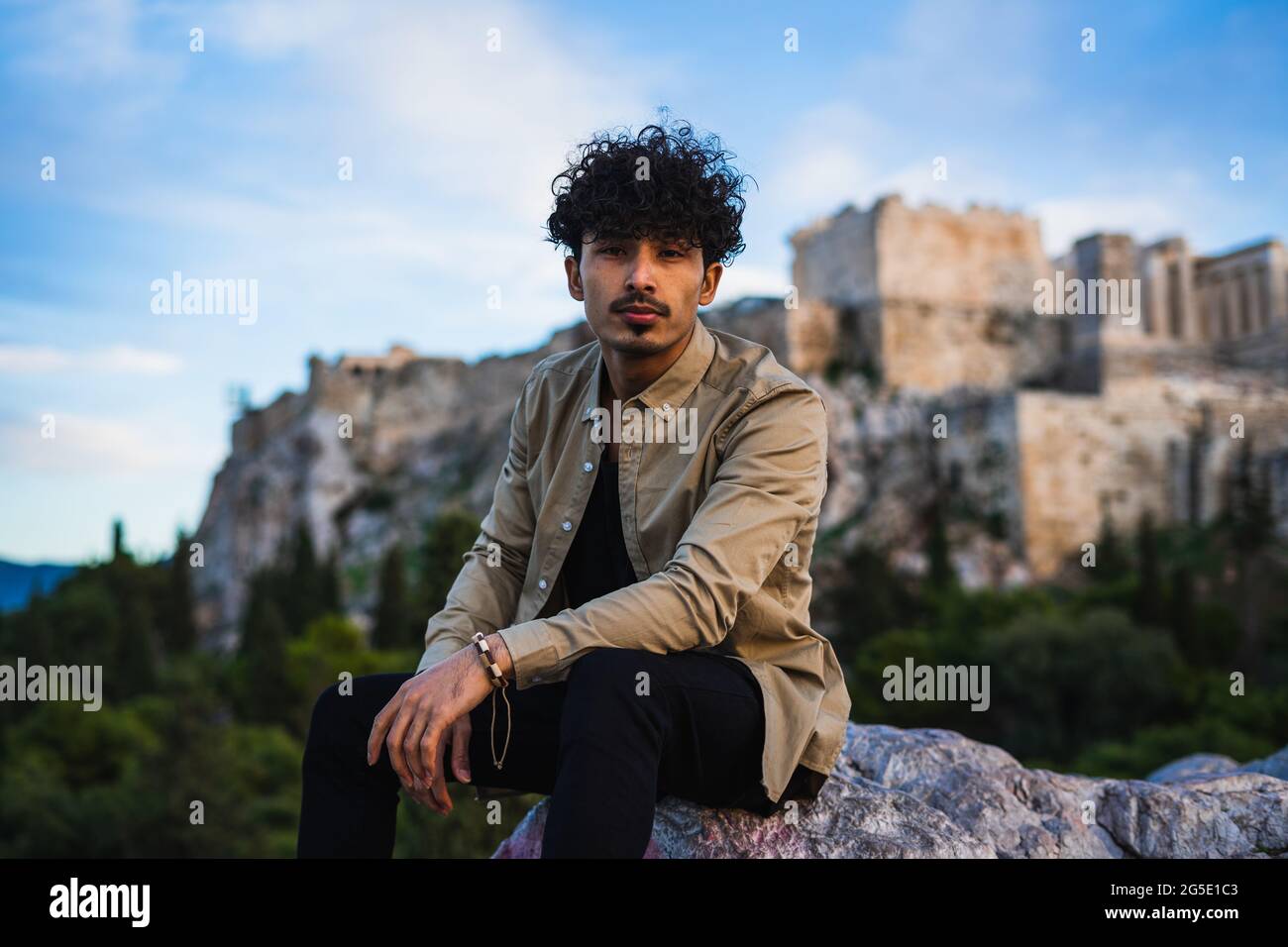 Young exotic boy model posing on the street Stock Photo - Alamy
