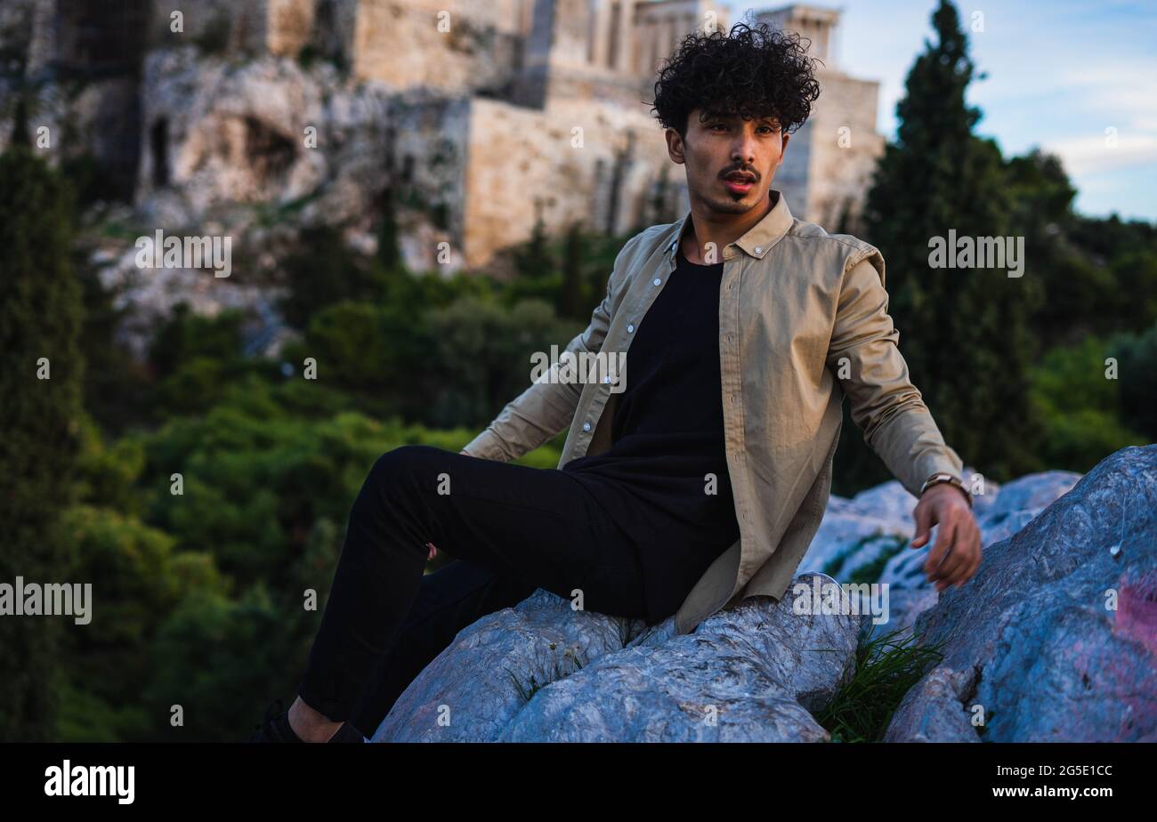 Young exotic boy model posing on the street Stock Photo - Alamy