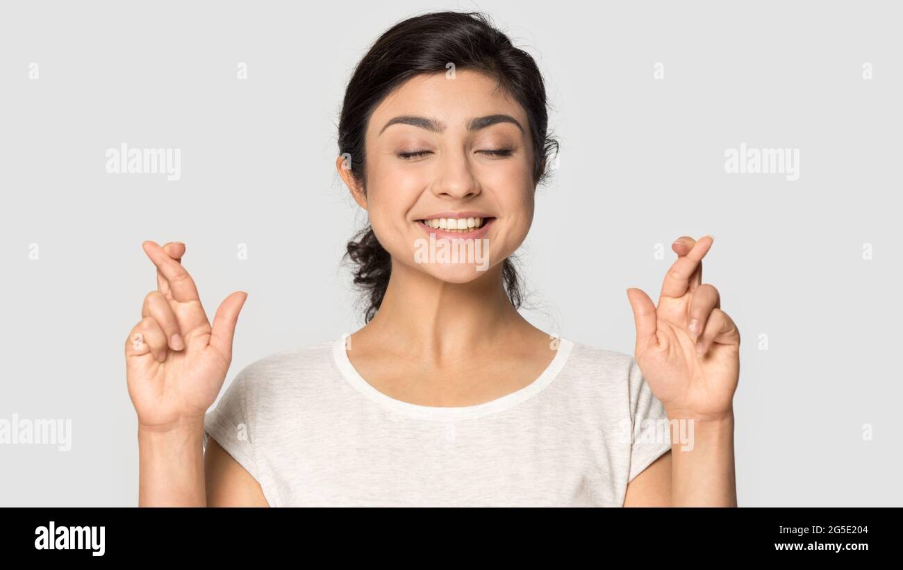 Happy woman good luck sign hi-res stock photography and images - Alamy