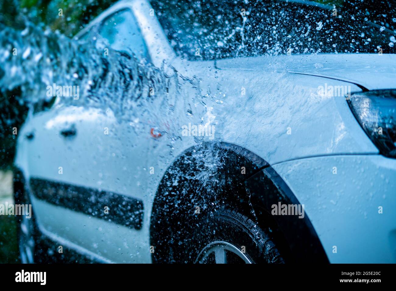 water splashes to clean and wash the car surface Stock Photo - Alamy
