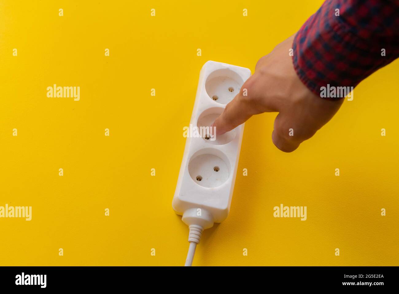 caution, hand insert the finger into the electricity socket, danger and ...