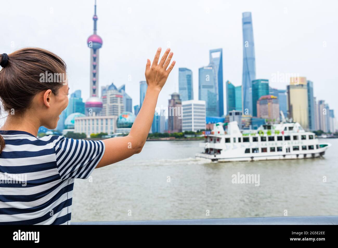 Girl waving goodbye hi-res stock photography and images - Alamy