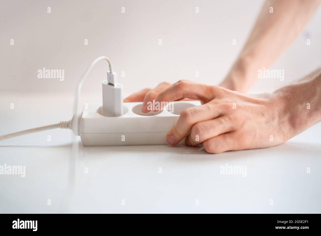 caution, hand insert the finger into the electricity socket, danger and ...