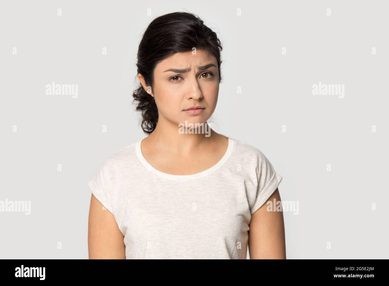 Unhappy Indian woman look at camera feeling distressed Stock Photo - Alamy