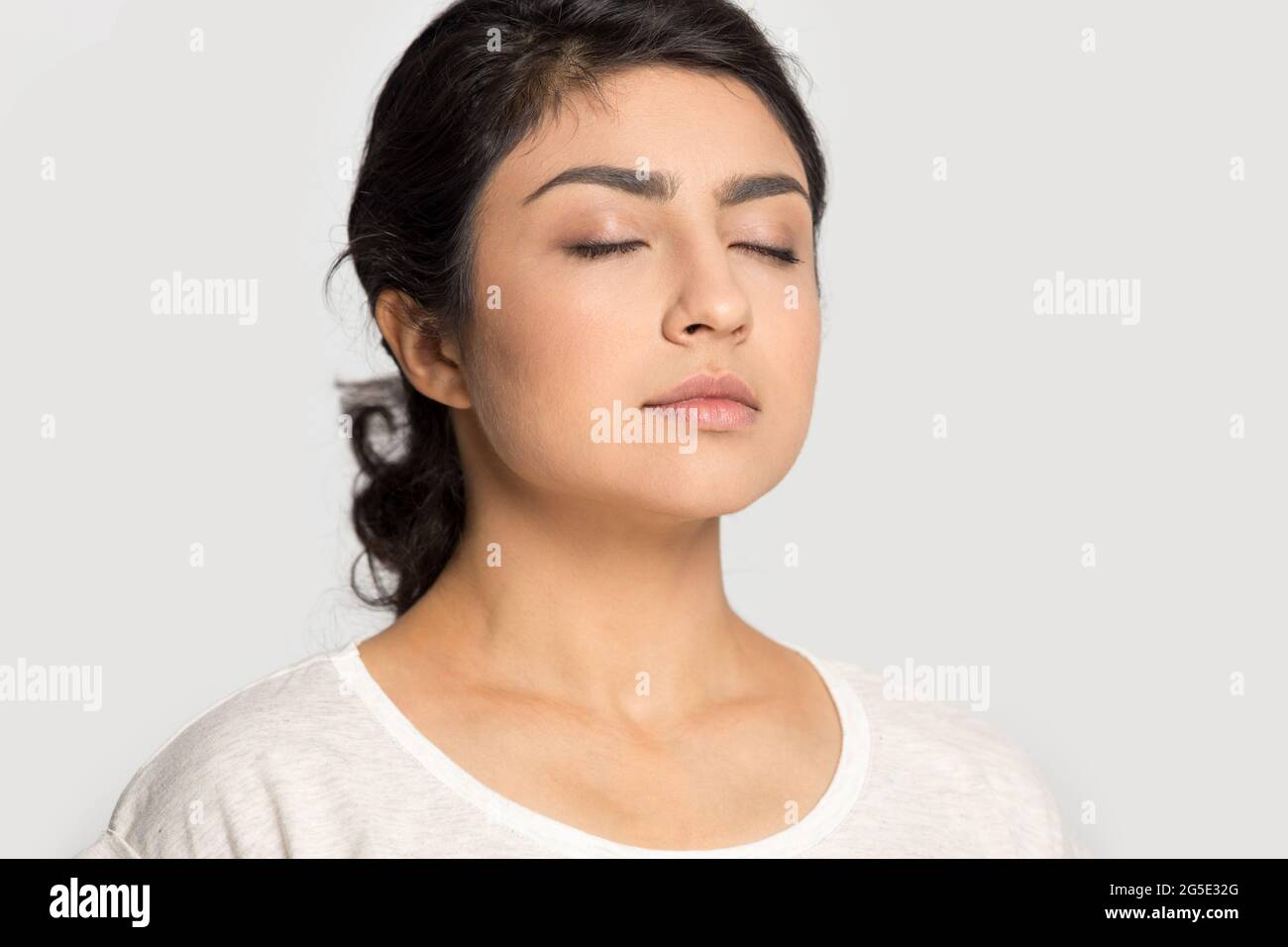 Calm Indian woman breathe fresh air meditating Stock Photo - Alamy