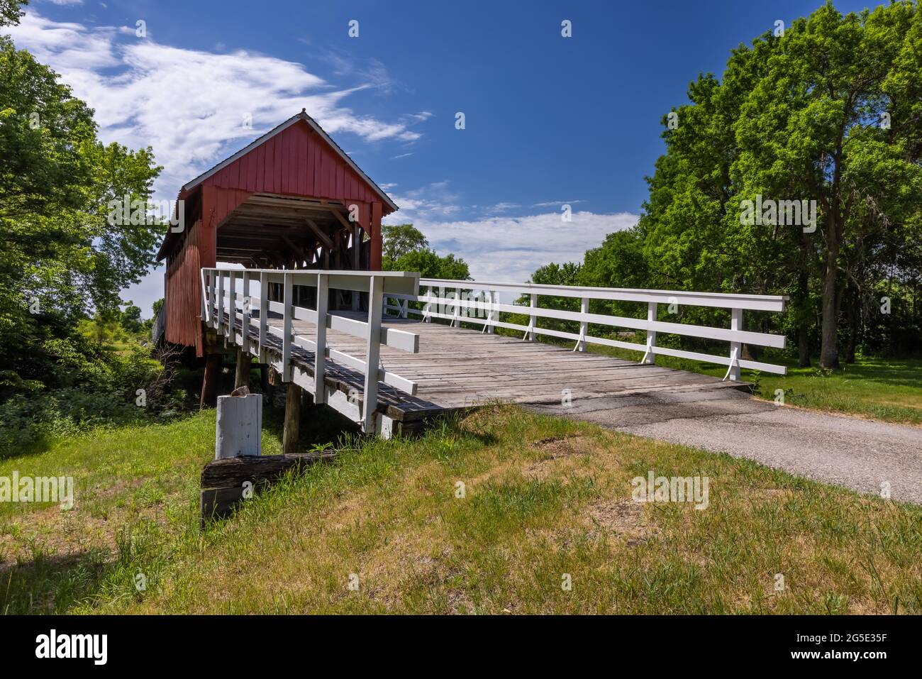 An old red wooden covered bridge in rural Iowa Stock Photo - Alamy