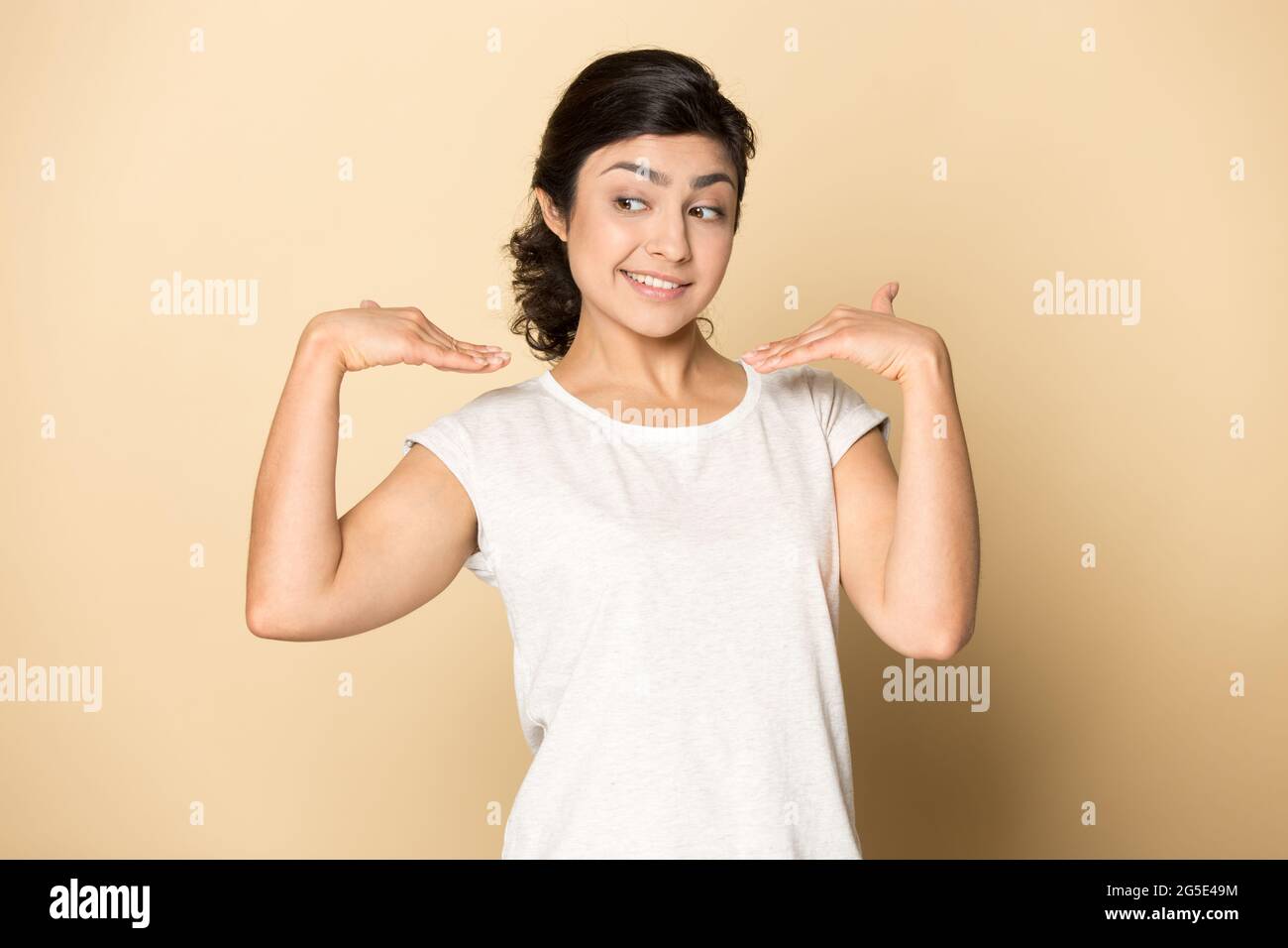 Smiling Indian woman demonstrate face posing in studio Stock Photo - Alamy